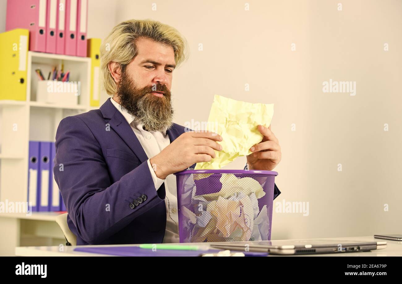 Office spy. Digging in the trash. Rummaging through the papers ...