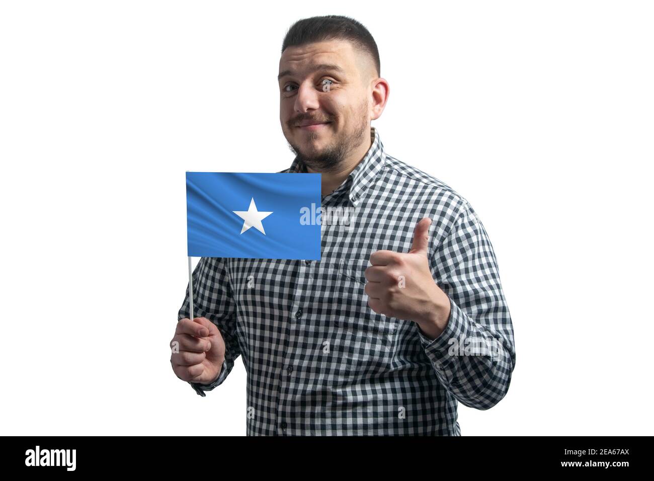 White guy holding a flag of Somalia and shows the class by hand ...