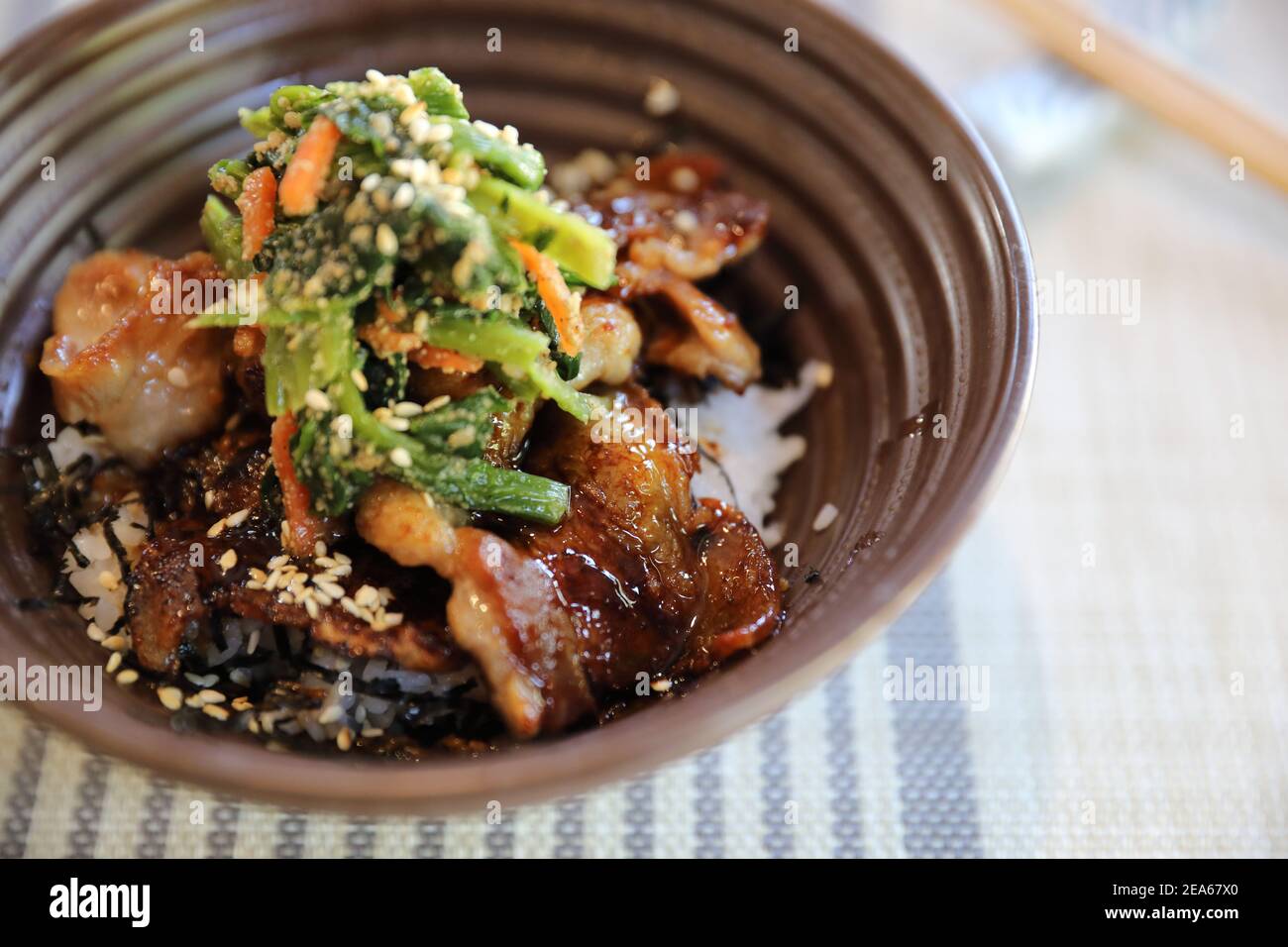 Grilled pork bowl japanese buta donburi on wood background Stock Photo ...