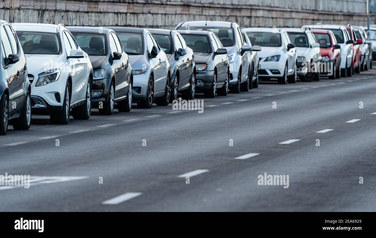 Many cars travelling on a road Stock Photo - Alamy