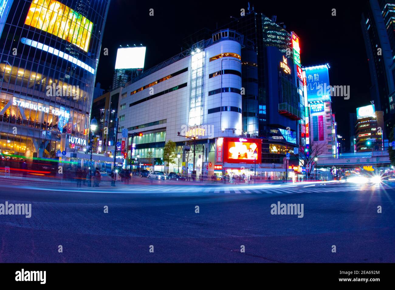 A night neon crossing in Shibuya wide shot Stock Photo - Alamy