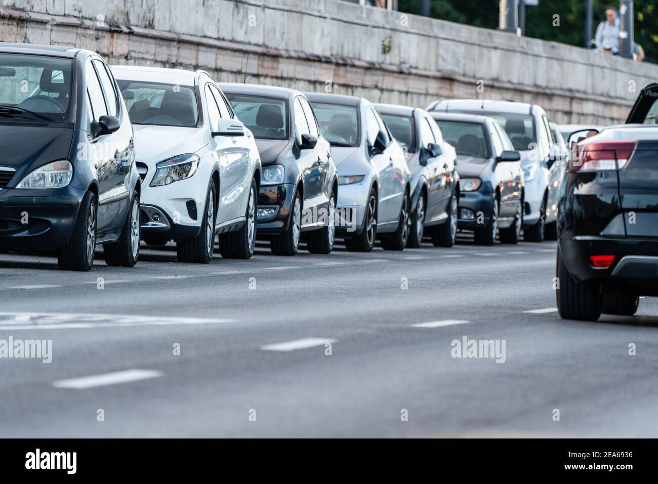 Many cars travelling on a road Stock Photo - Alamy