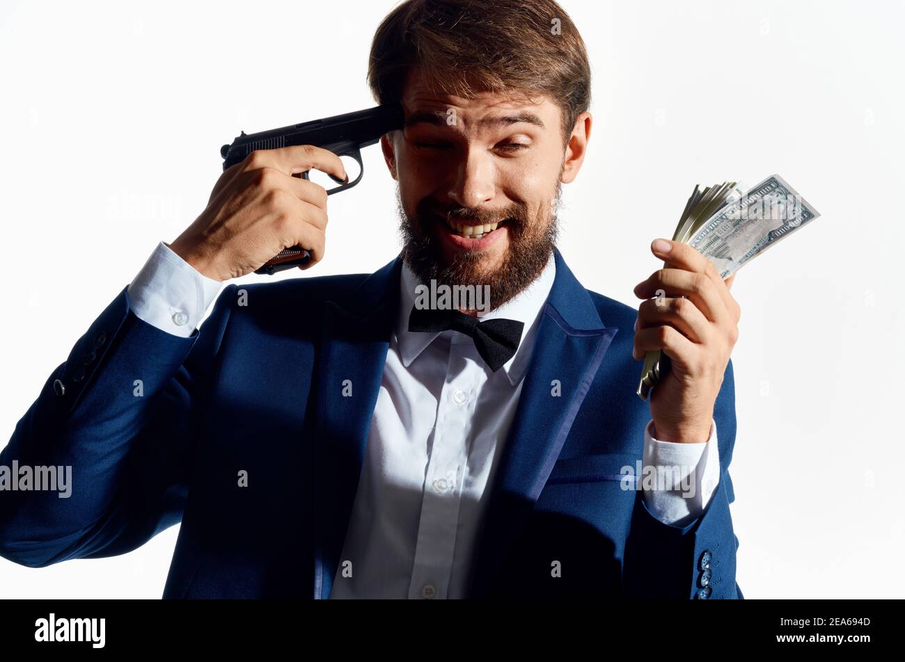rich man with gun and wad of money classic suit white background Stock ...
