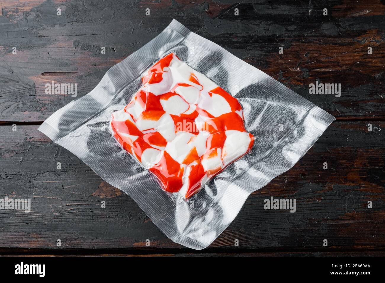 Crab meat surimi vacuum pack set, on dark wooden background Stock Photo ...