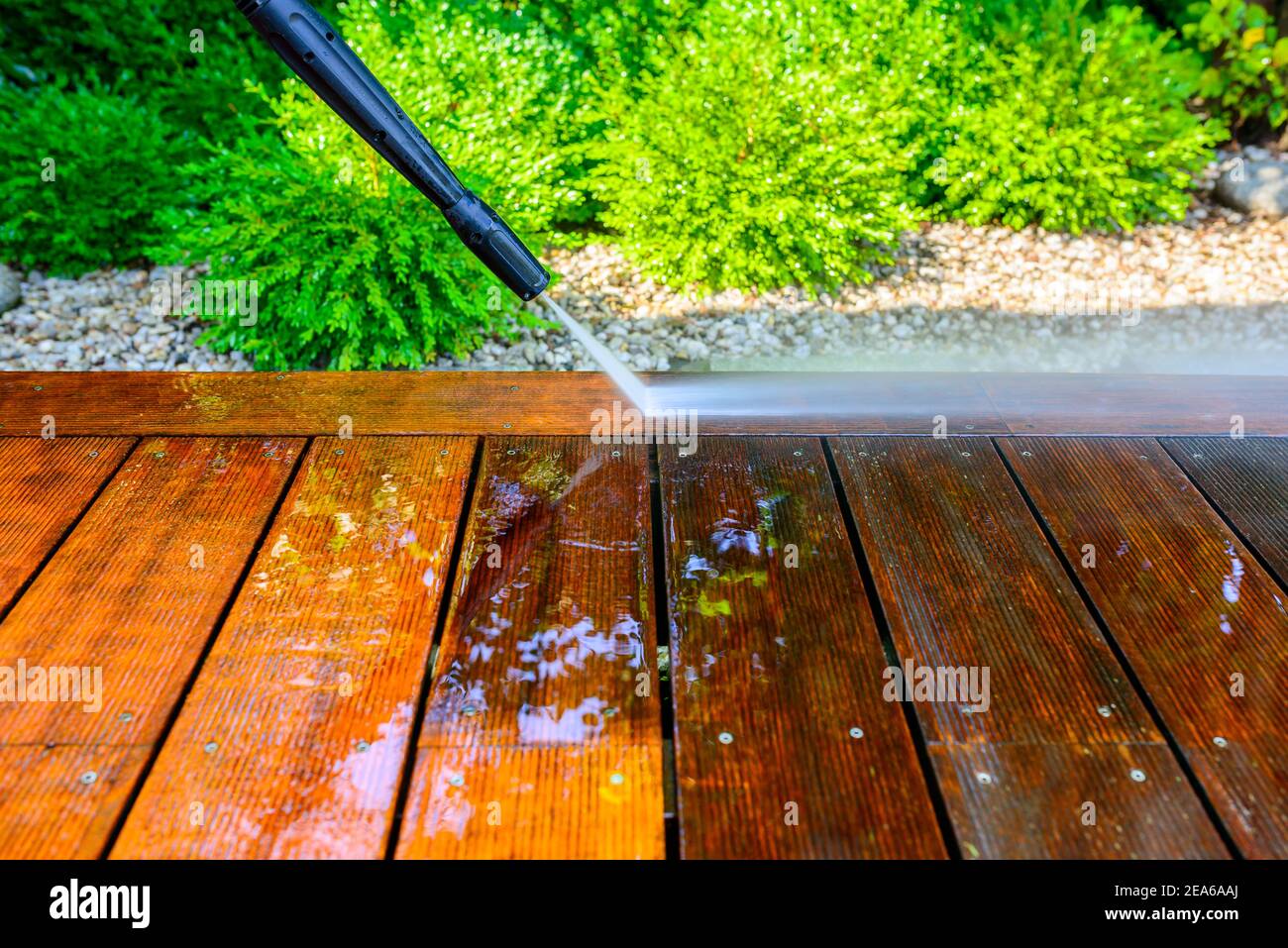 cleaning terrace with a power washer - high water pressure cleaner on ...