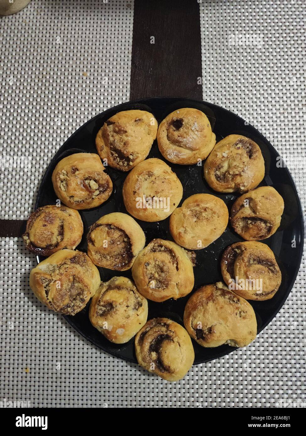 a beautiful baked sweet buns on a baking sheet Stock Photo - Alamy