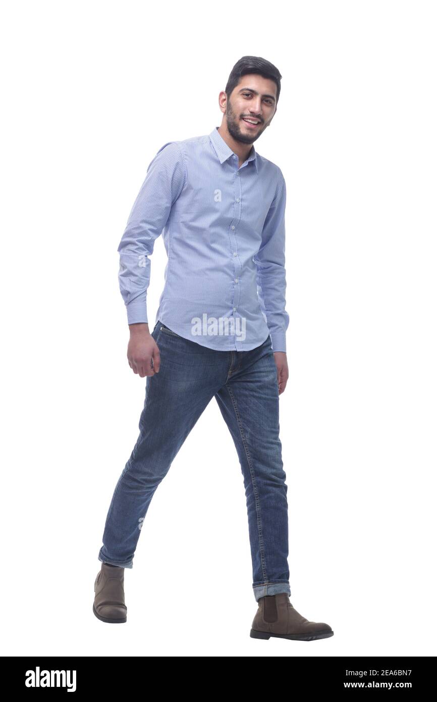 confident young man in jeans striding forward Stock Photo - Alamy