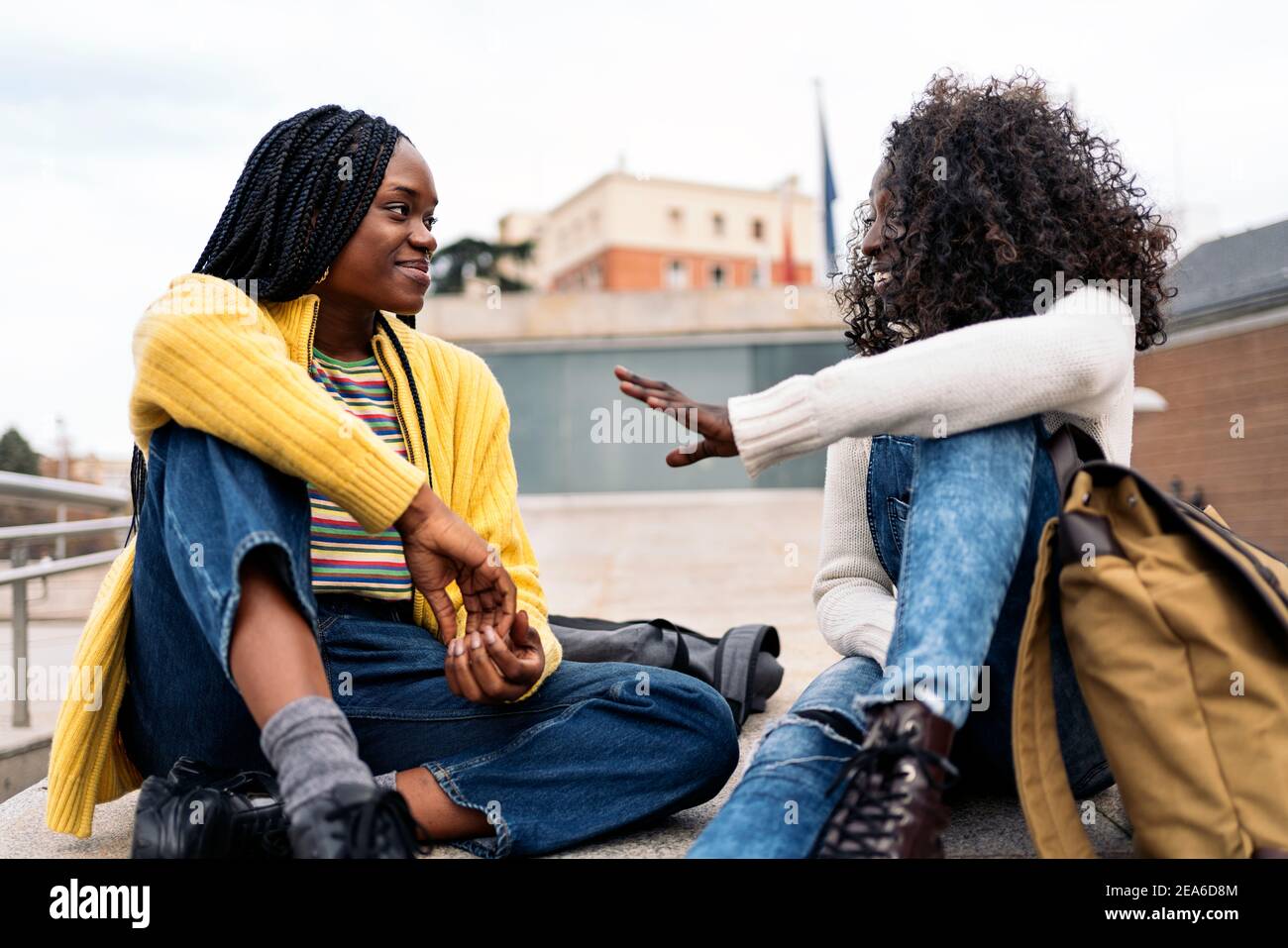 Stock photo of happy female black friends laughing and enjoying evening ...