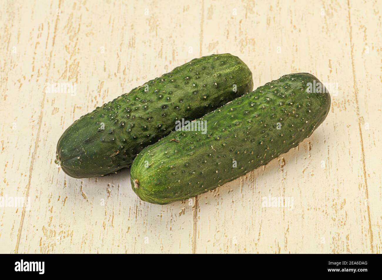 Green fresh two cucumbers over background Stock Photo - Alamy