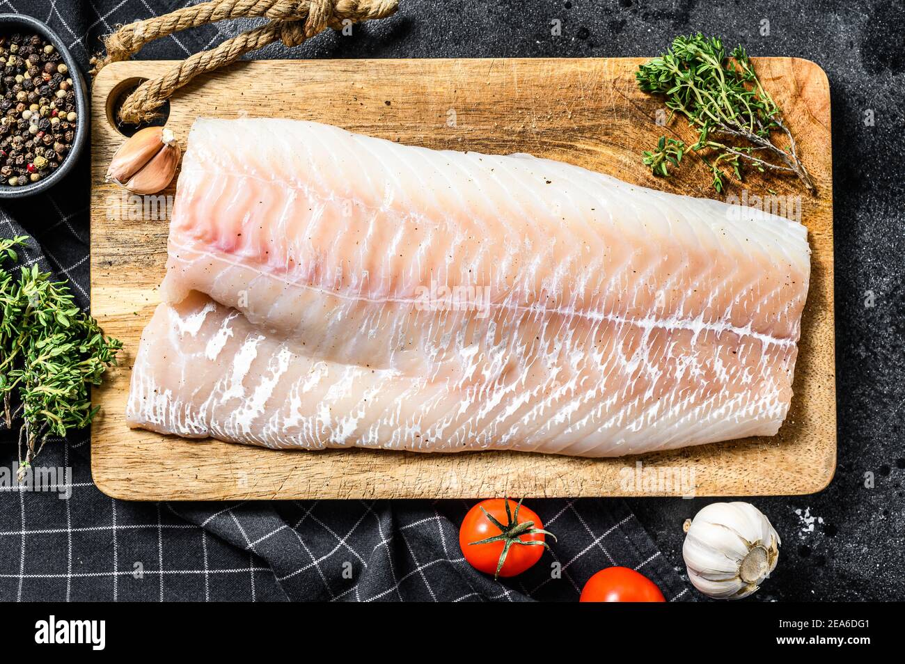 Fresh Raw Cod loin fillet with thyme. Black background. Top view Stock ...