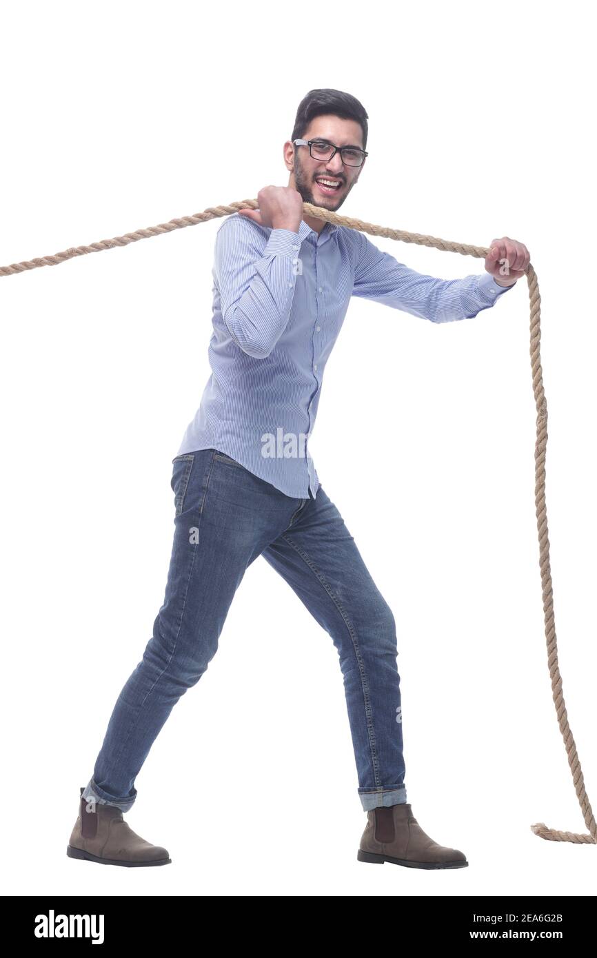 purposeful young man pulls the rope. isolated on a white background ...