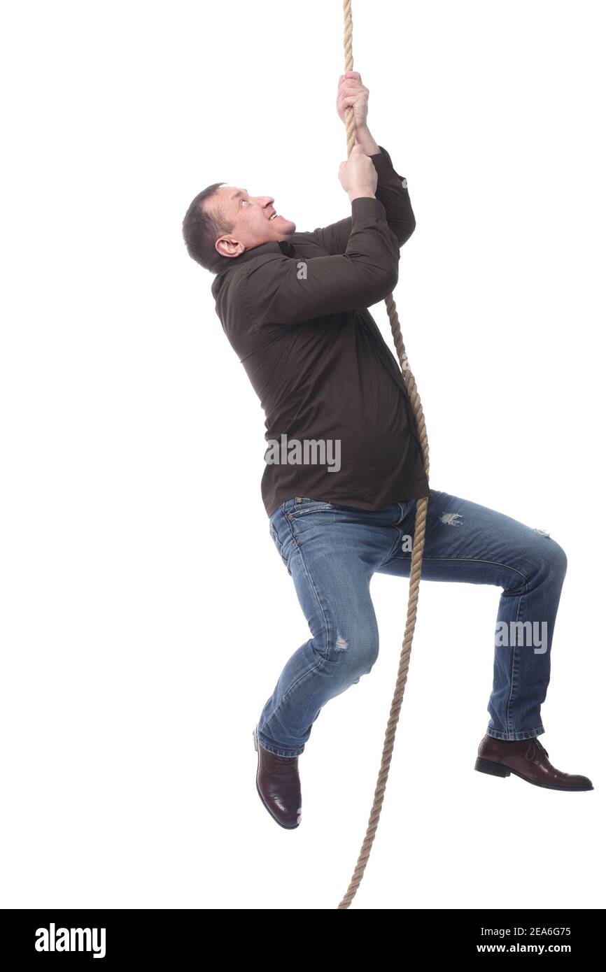 purposeful man climbing the rope. isolated on a white background Stock ...