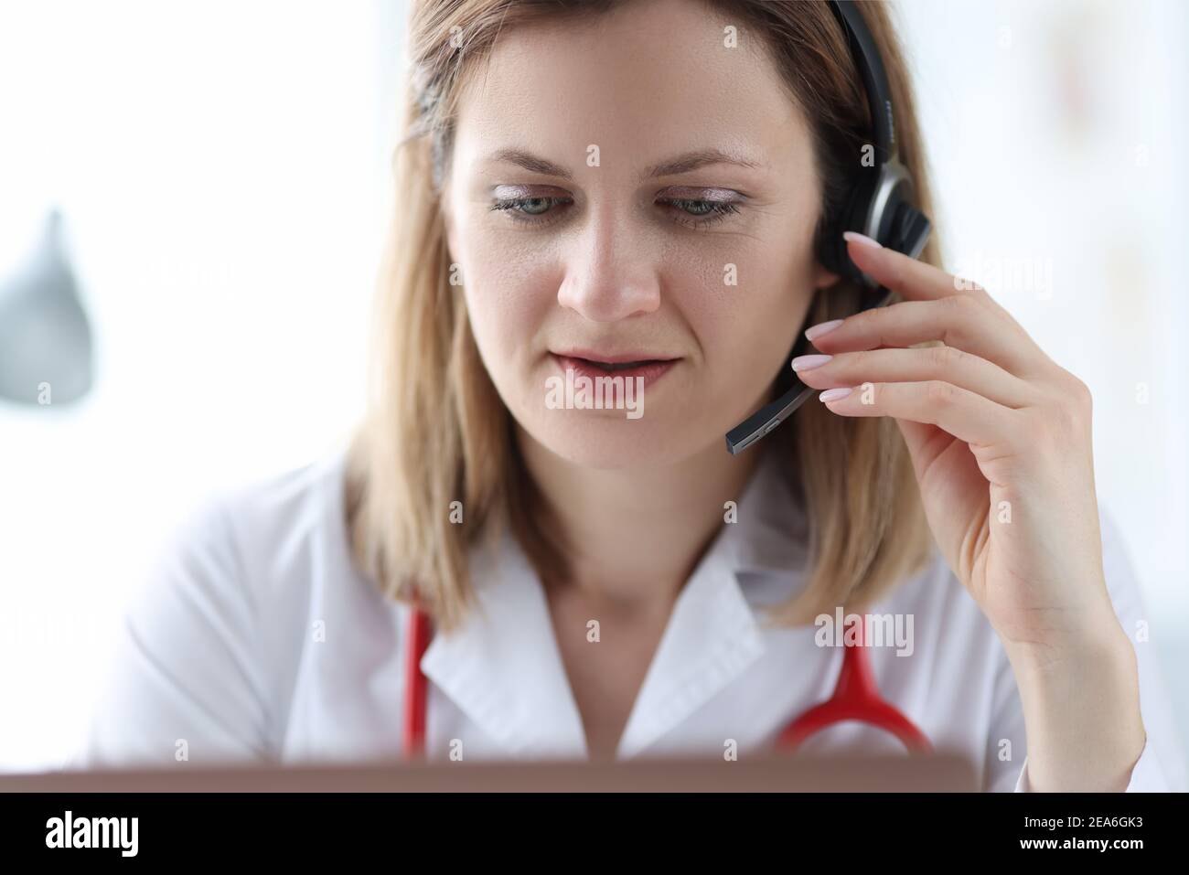 Female doctor headphones in hi-res stock photography and images - Alamy