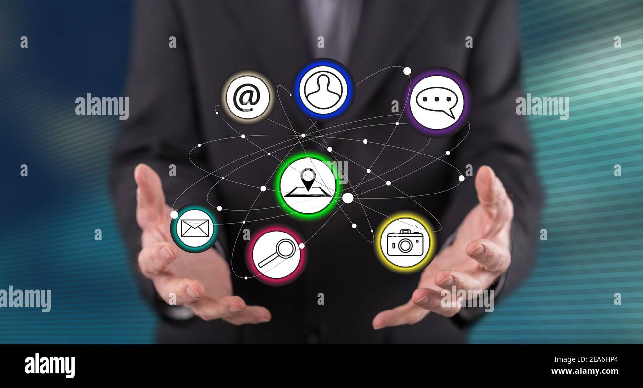 Apps concept above the hands of a man in background Stock Photo - Alamy