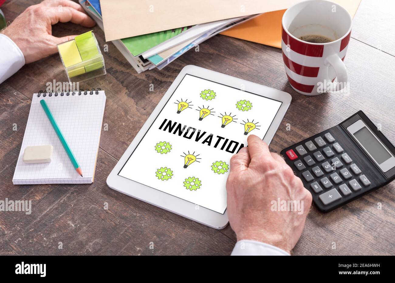 Man using a tablet showing an innovation concept Stock Photo - Alamy