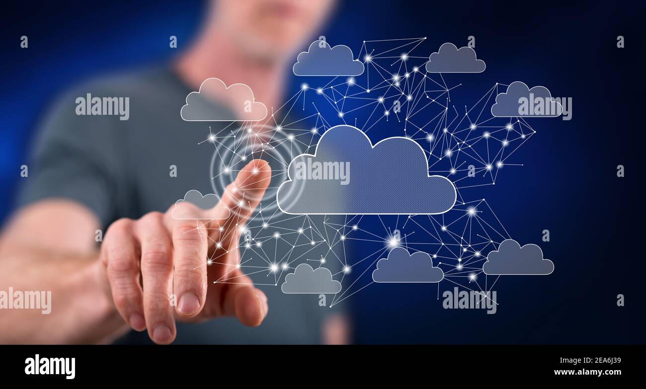 Man touching a cloud networking concept on a touch screen with his ...