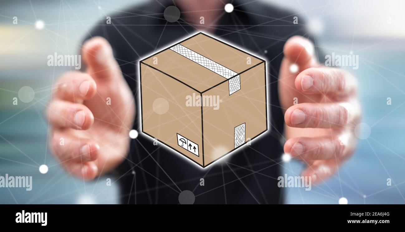 Packaging concept between hands of a man in background Stock Photo - Alamy