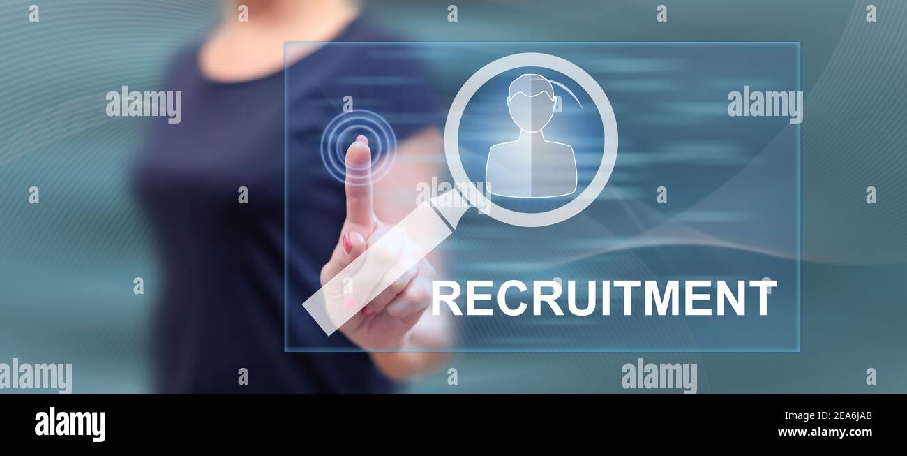 Woman touching a recruitment concept on a touch screen with her finger ...