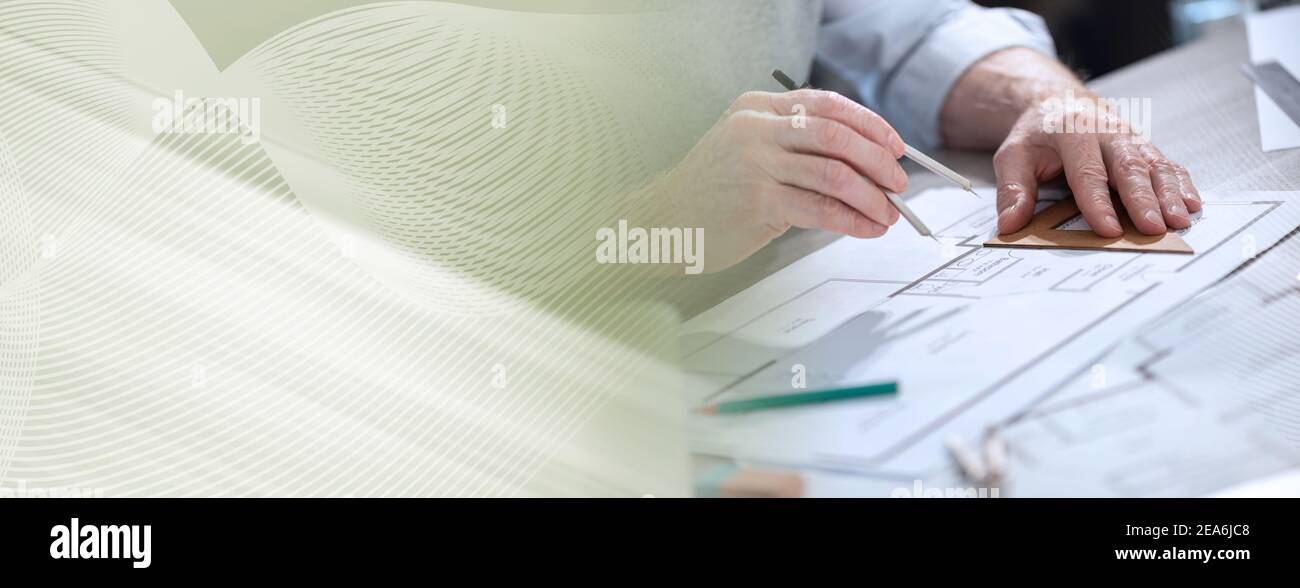 Architect working on a project and using a compass; panoramic banner ...