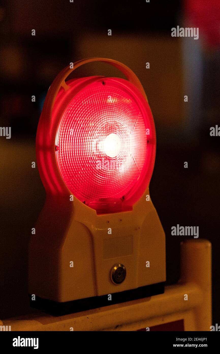 Selective focus shot of the red warning lamp burning at night Stock ...