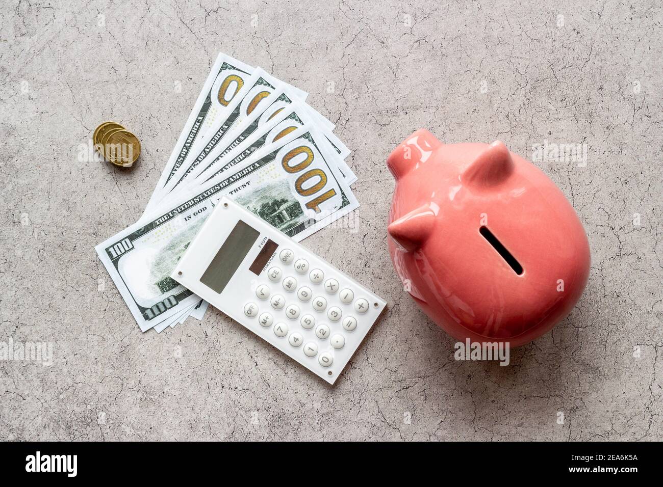Piggy bank with cash money and calculator. Saving money concept Stock ...