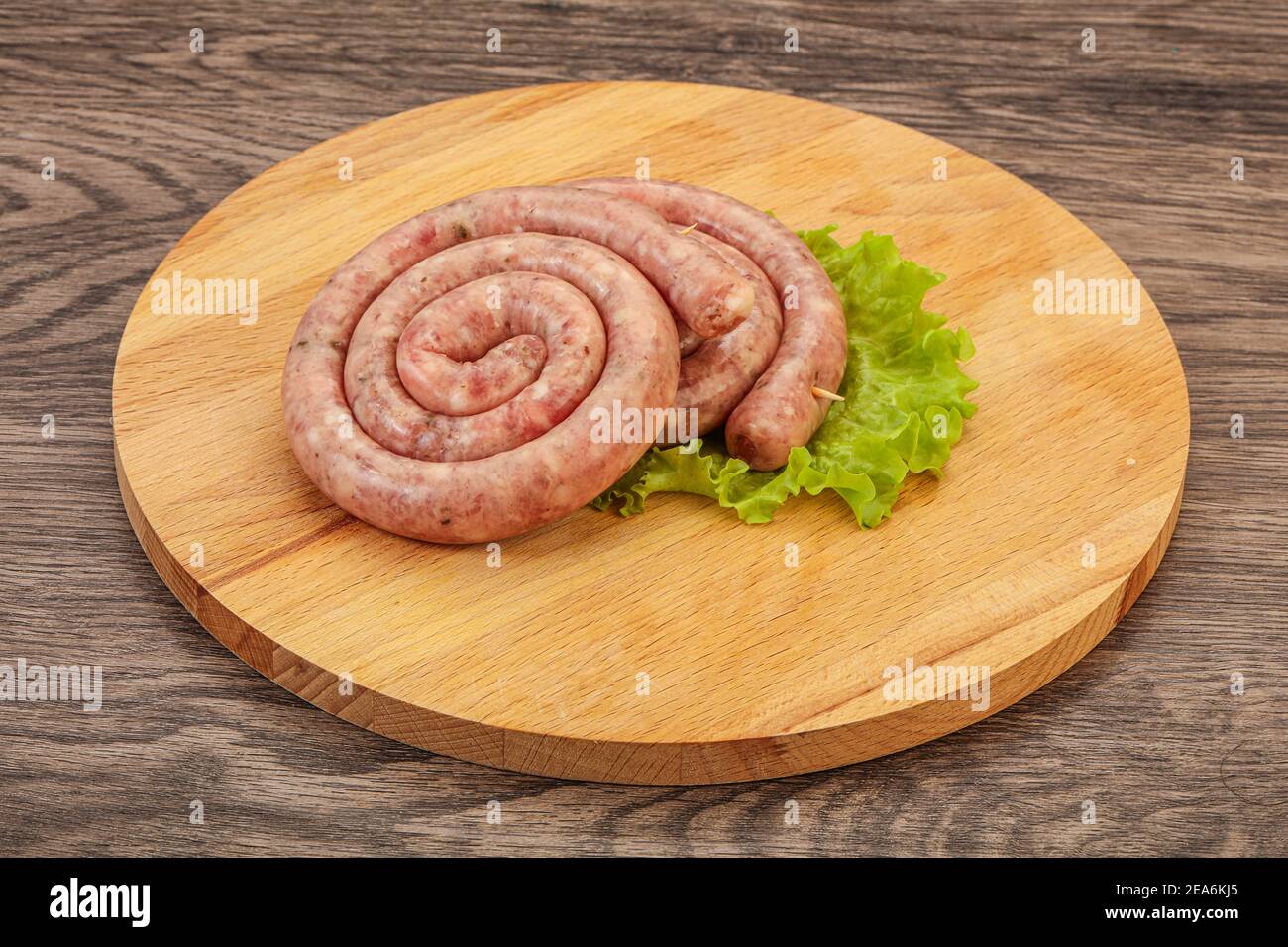 Raw pork sausage ring for grill Stock Photo - Alamy
