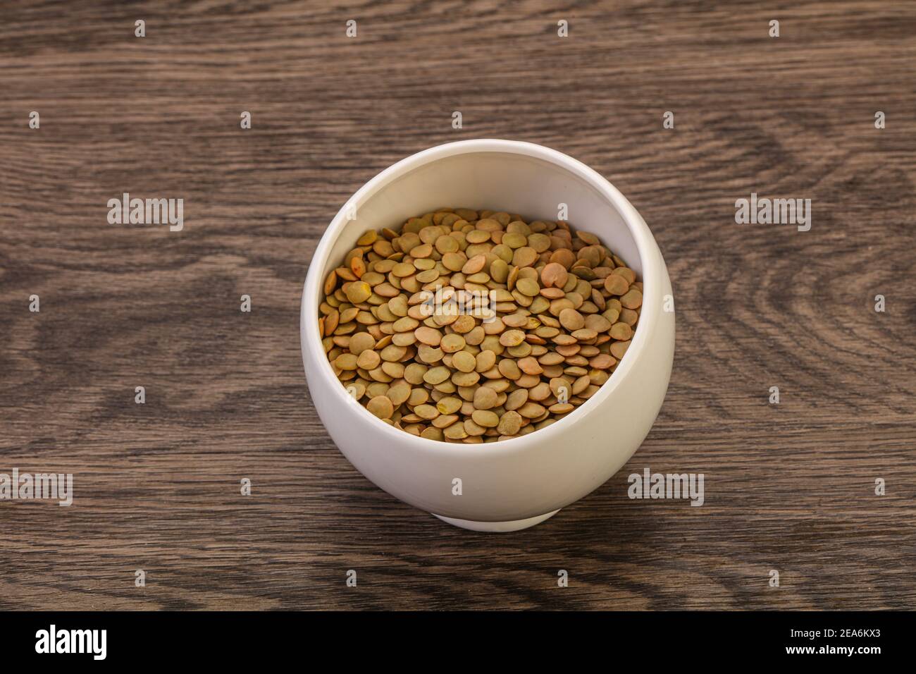 Vegan cuisine - Dry lentil heap isolated Stock Photo - Alamy