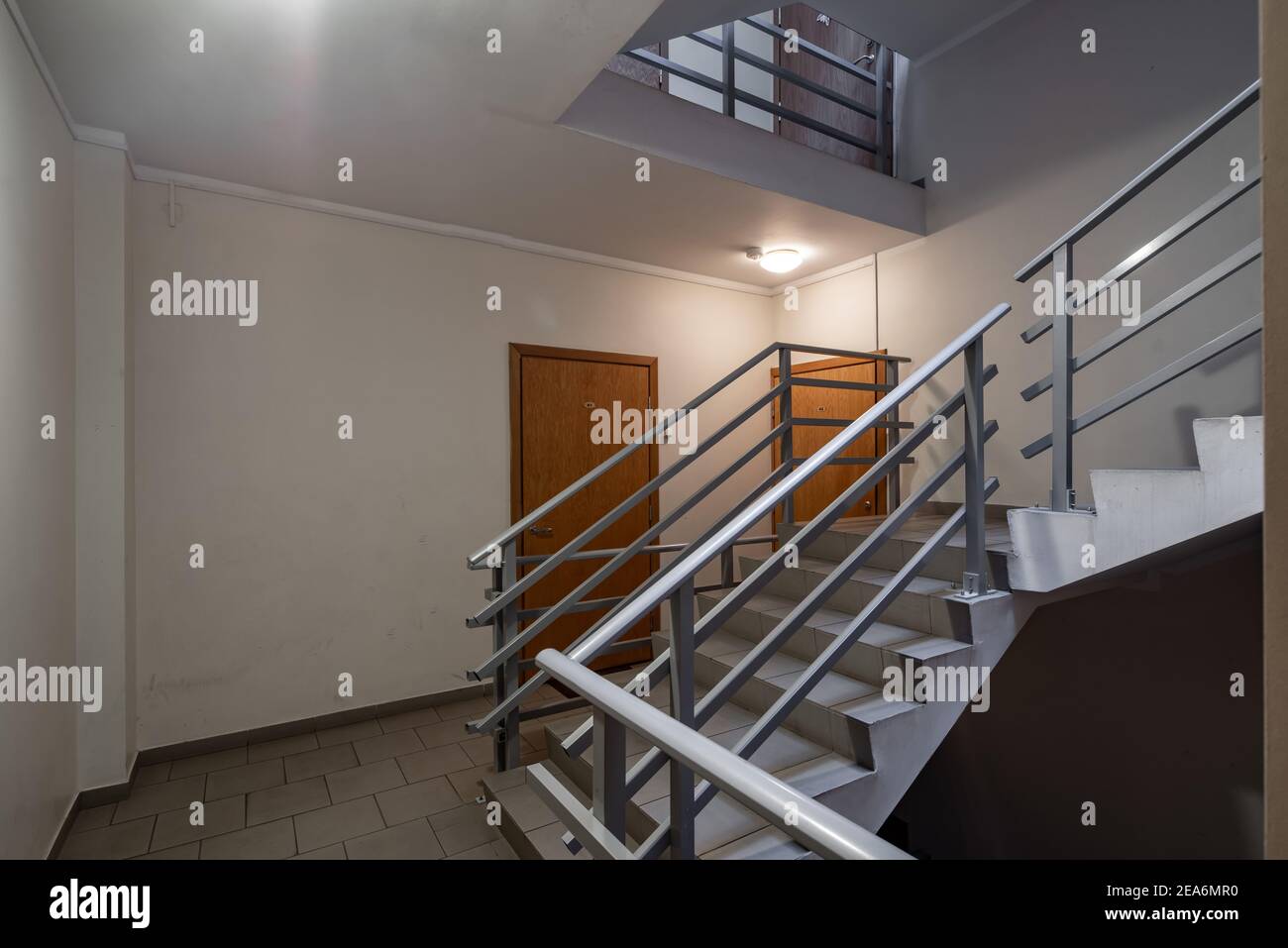 Interior of entrance in modern residential complex. Staircase. Block of ...