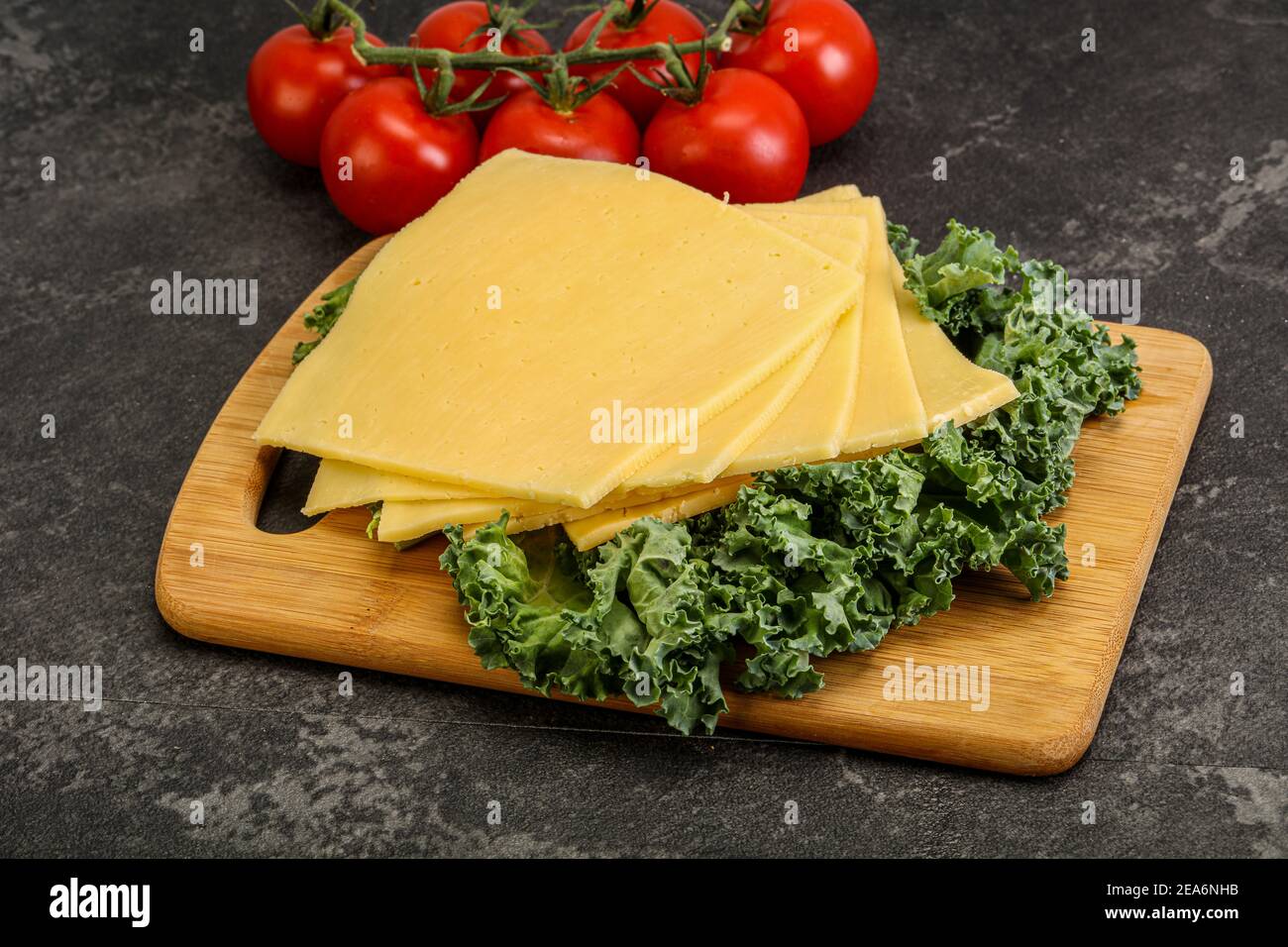 Sliced Gauda cheese snack over board Stock Photo - Alamy