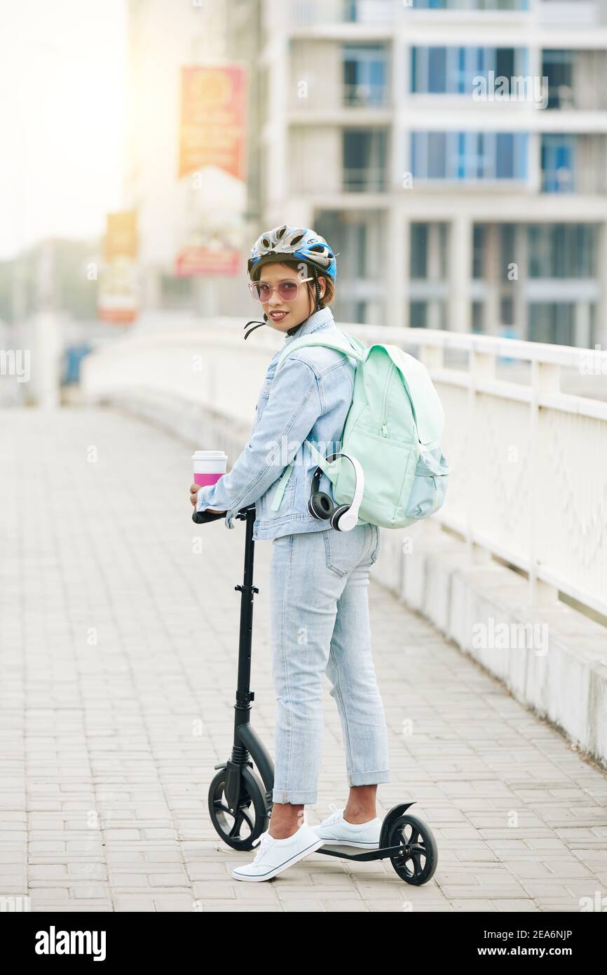 Woman riding on electric scooter Stock Photo - Alamy