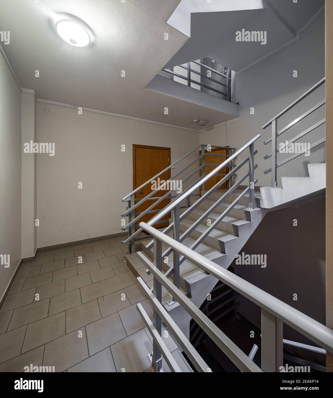 Interior of entrance in modern residential complex. Staircase. Block of ...