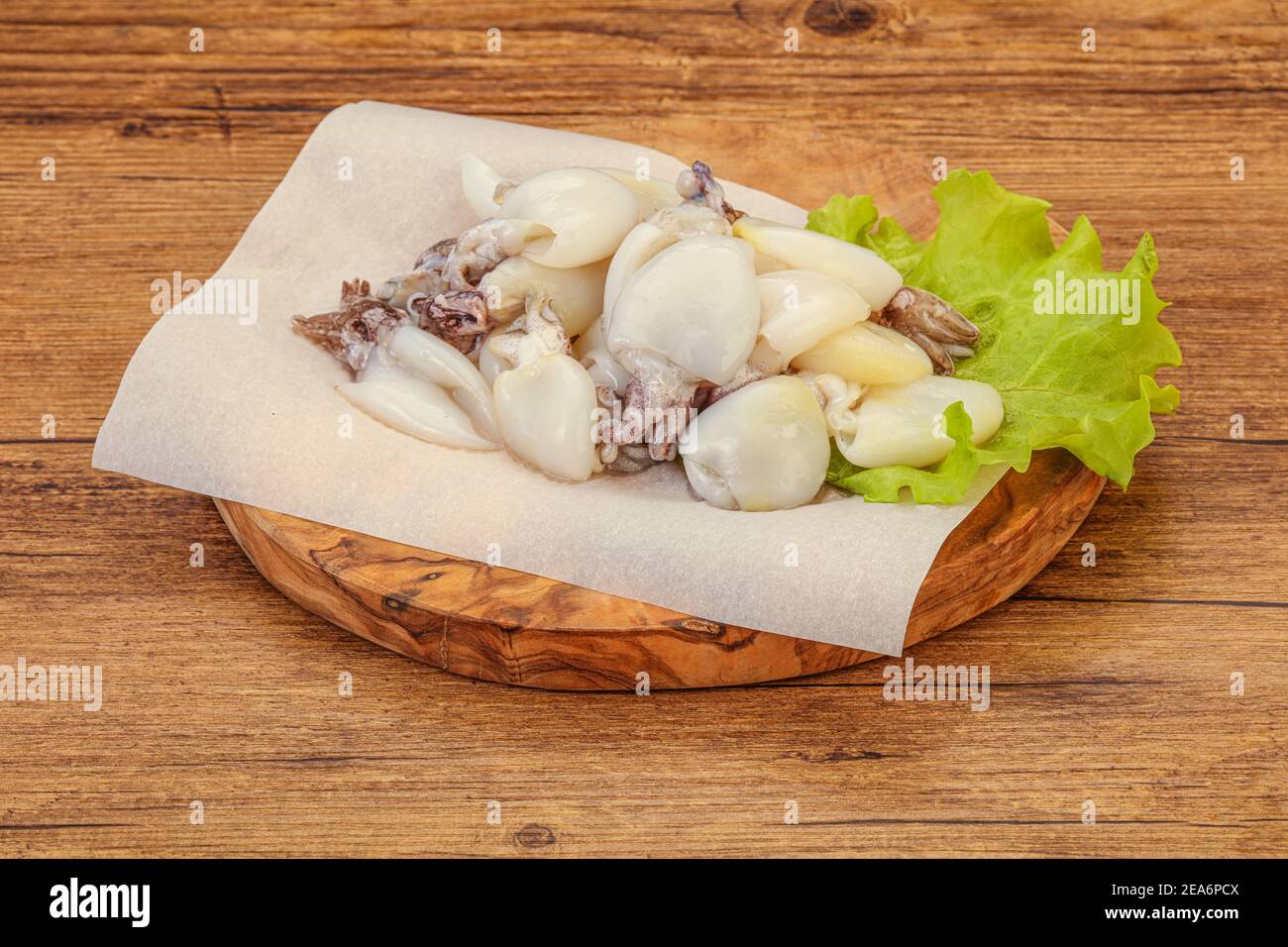 Raw seafood - cuttlefish for cooking over board Stock Photo - Alamy