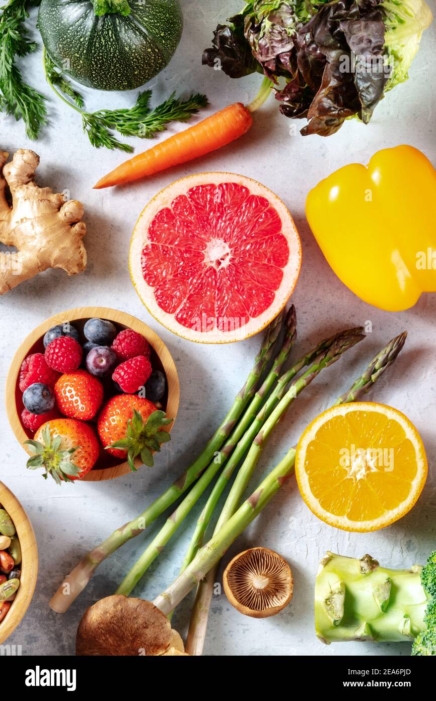 Vegan food, shot from above. Grapefruit, asparagus, and other ...