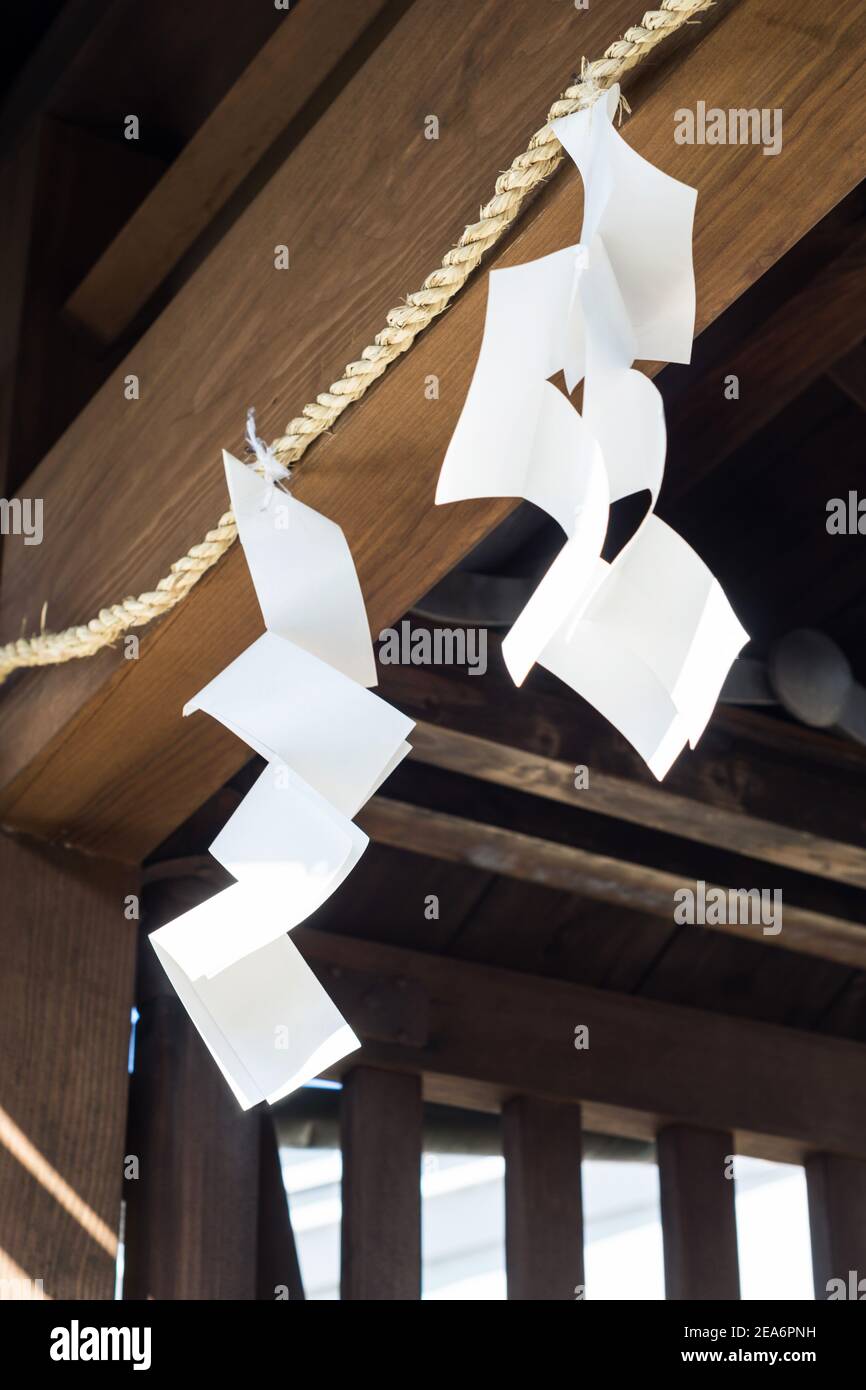 Two white Shide, zigzag-shaped paper streamers, used for purification ...