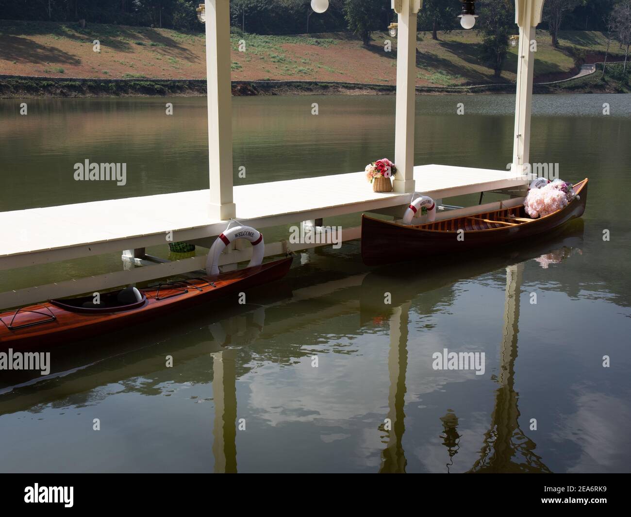 wooden rowing boat rowboat parking at harbor pier decorating with ...