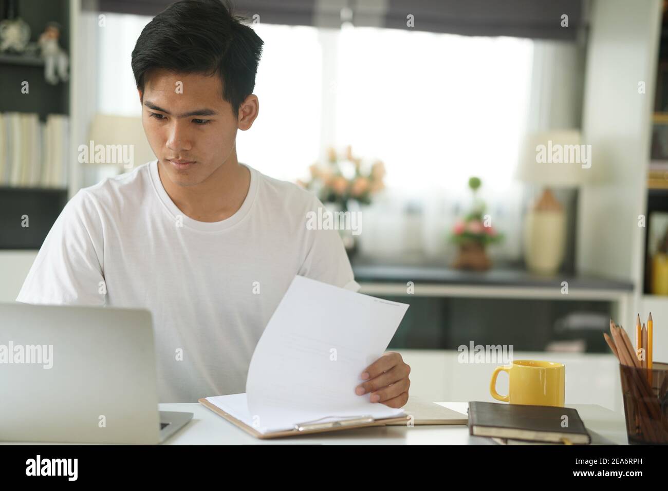 asian young teenage student man teenager entrepreneur working with ...