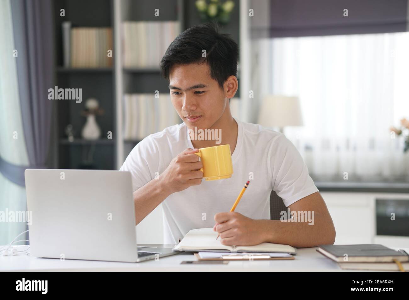 asian young teenage student man teenager entrepreneur working with ...