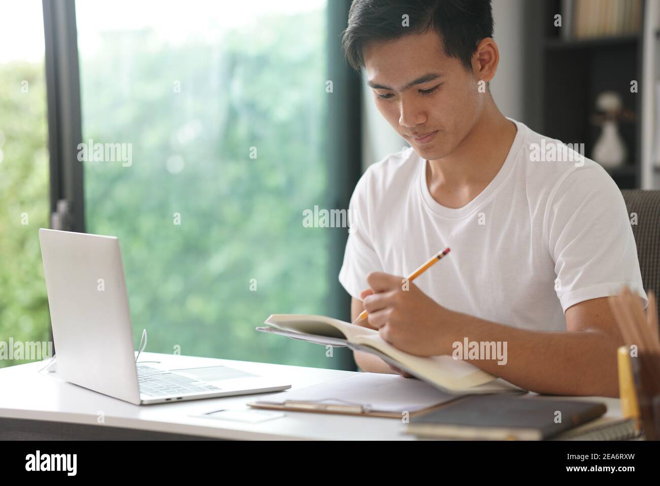 asian young teenage student man teenager entrepreneur working with ...