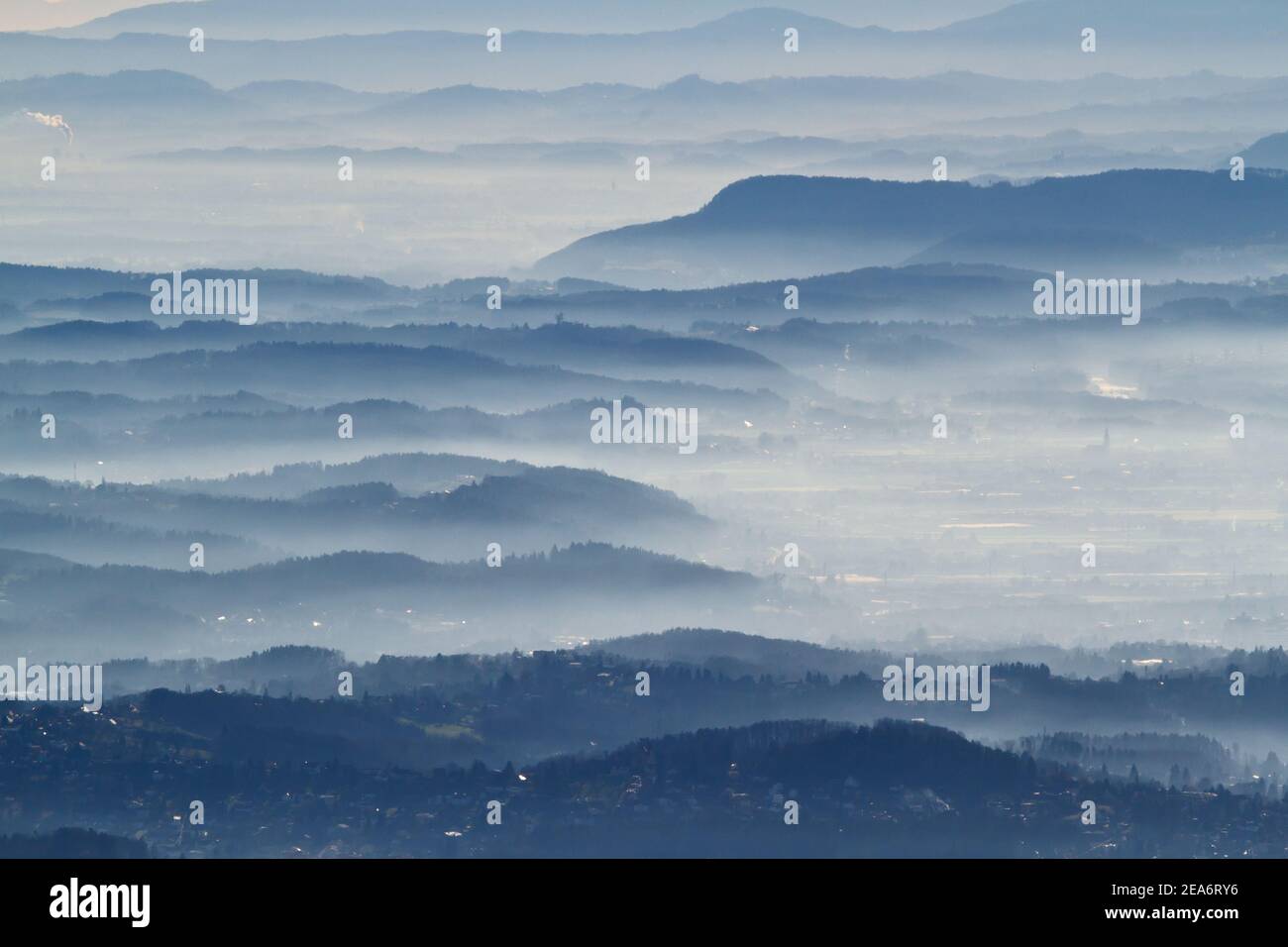 Dust, smoke and smog in the air above a hill landscape Stock Photo - Alamy