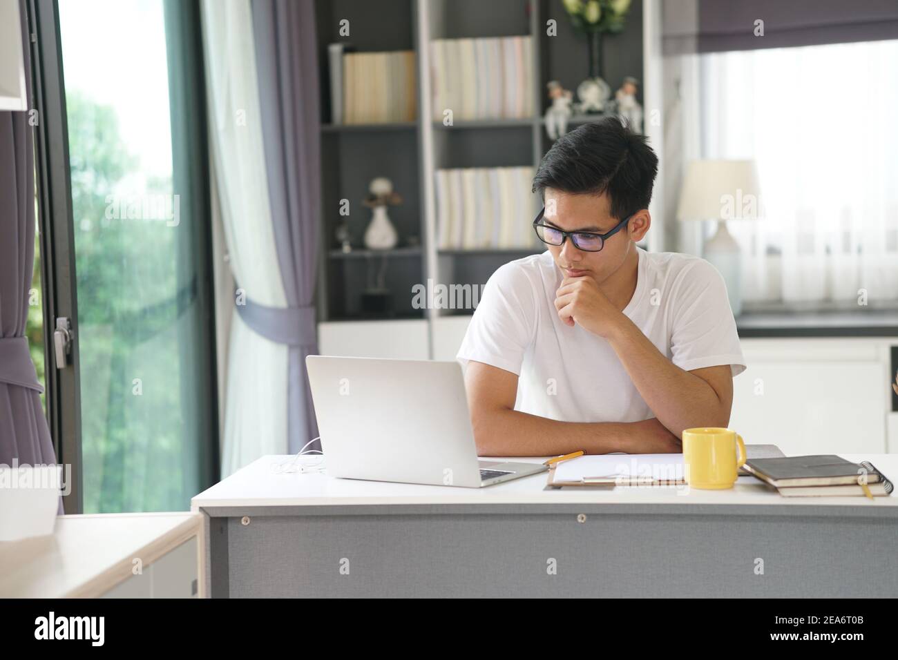 asian young teenage student man teenager entrepreneur working with ...