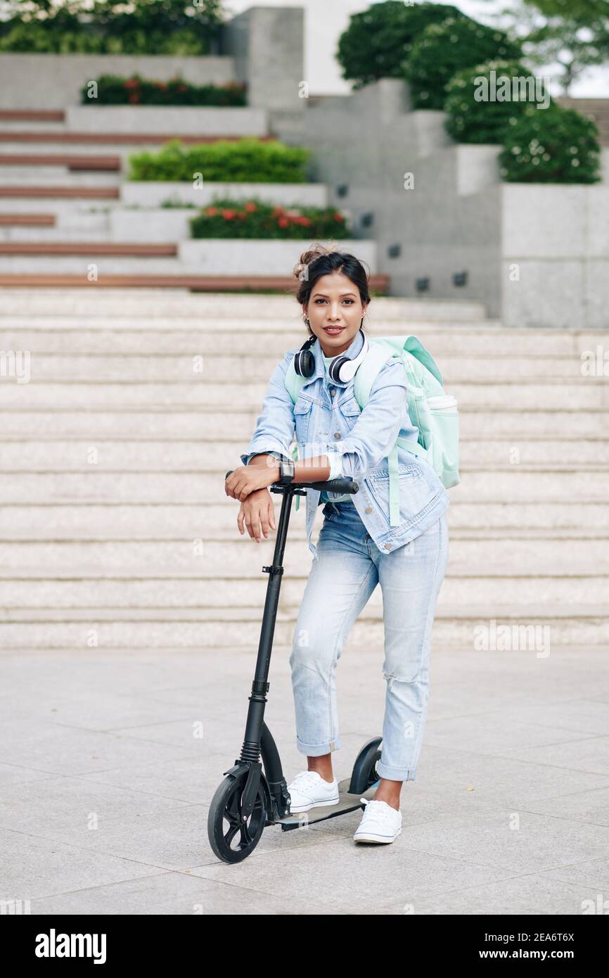 Female student on electric scooter Stock Photo - Alamy