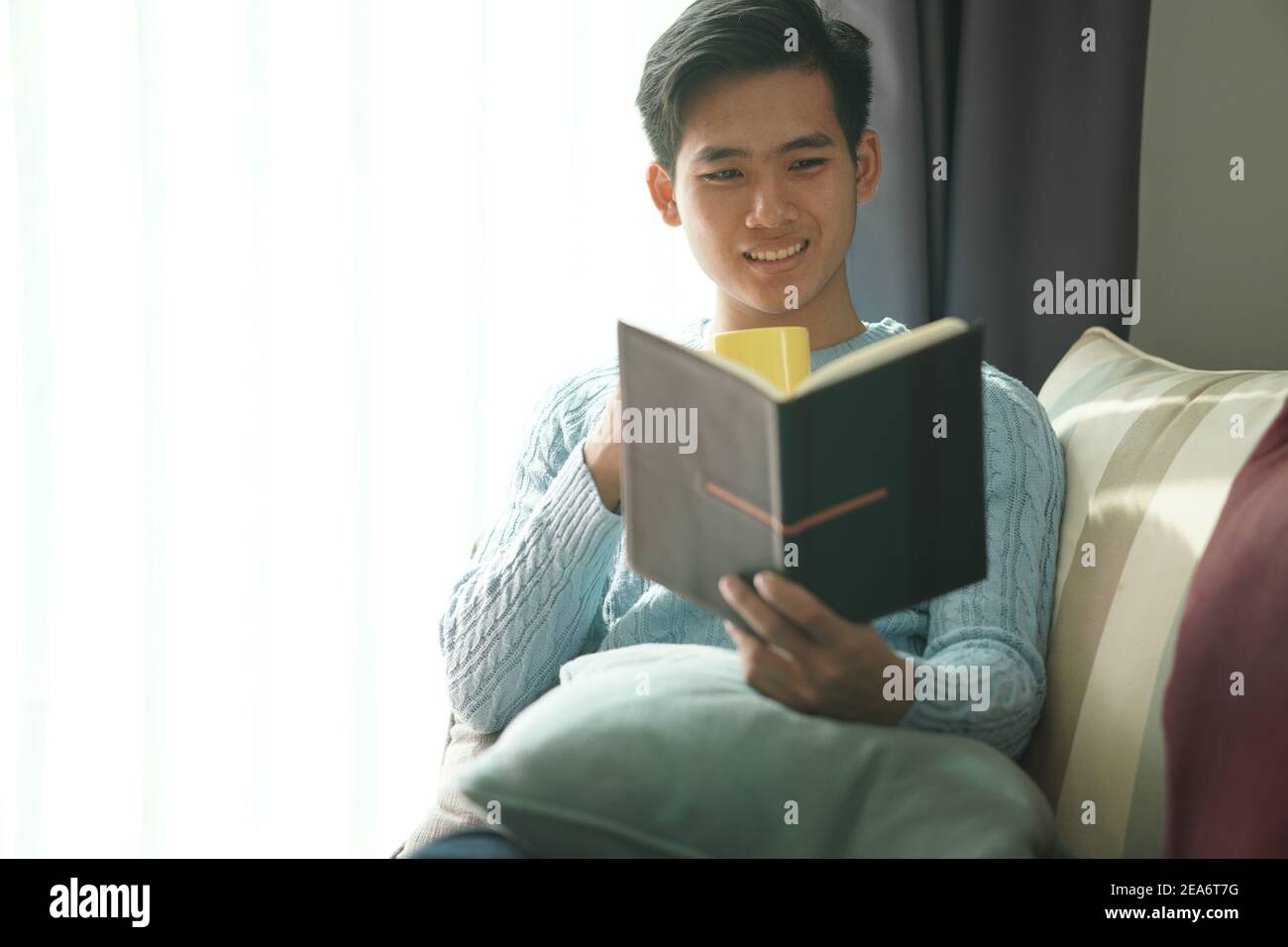 Asian man reading book hi-res stock photography and images - Alamy