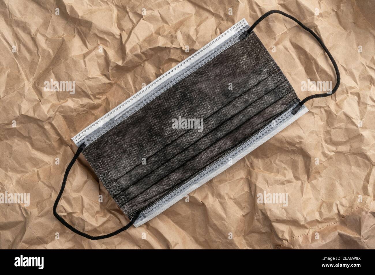 Black surgical mask with rubber ear loops. Medical hygienic mask ...