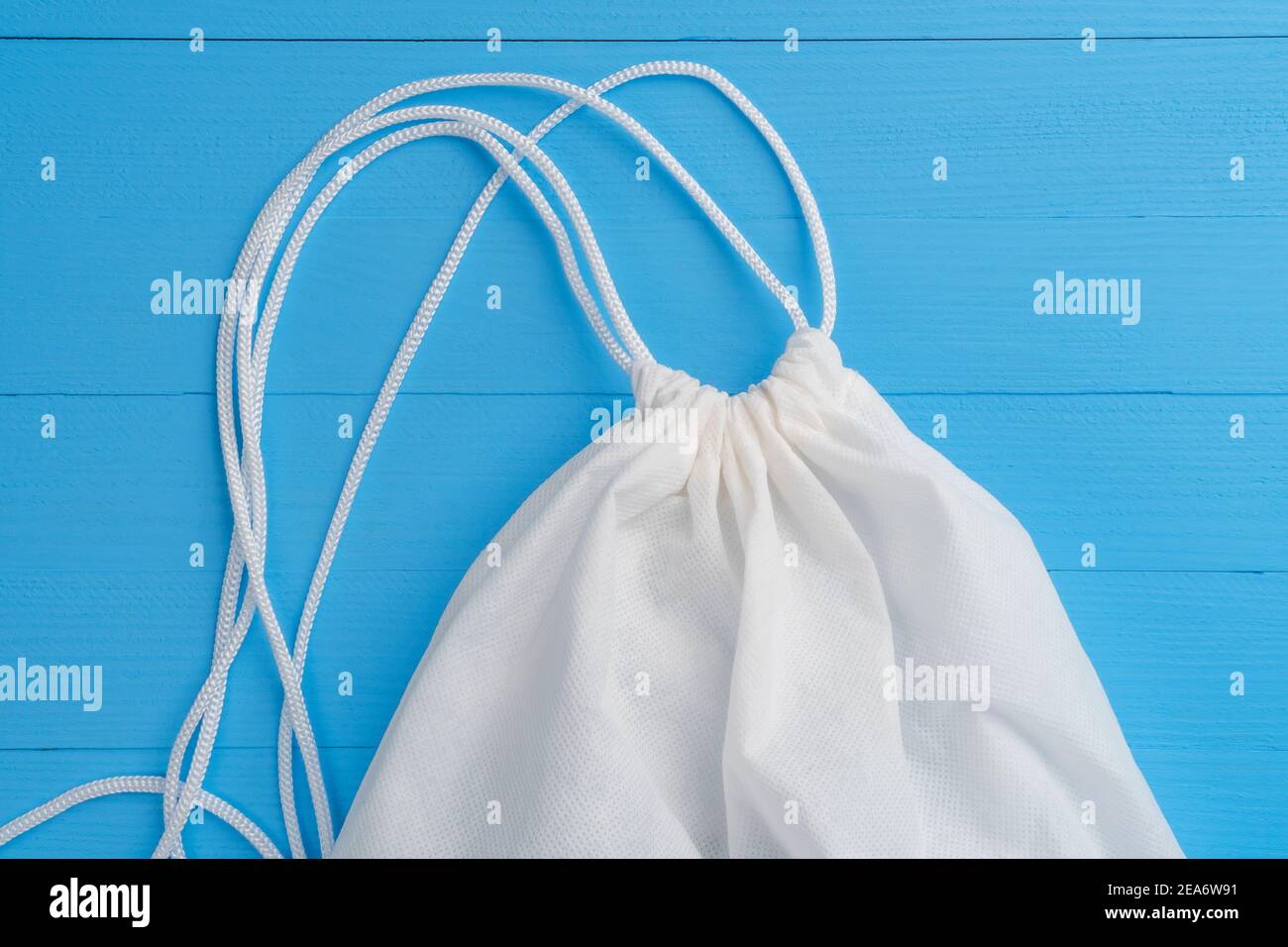 Knotted Rope Tied Closed Synthetic Textile Bag Close Up On Wooden Plank ...