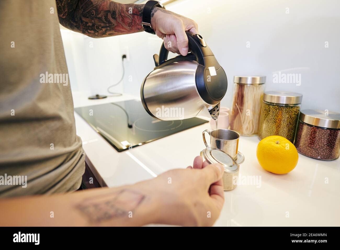 Man making hot coffee home hi-res stock photography and images - Alamy