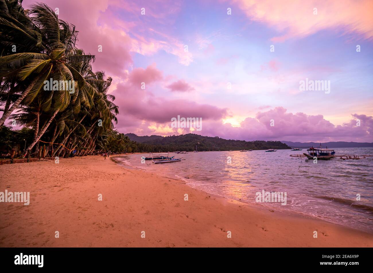 Port Barton Beach at sunset on paradise island, tropical travel ...