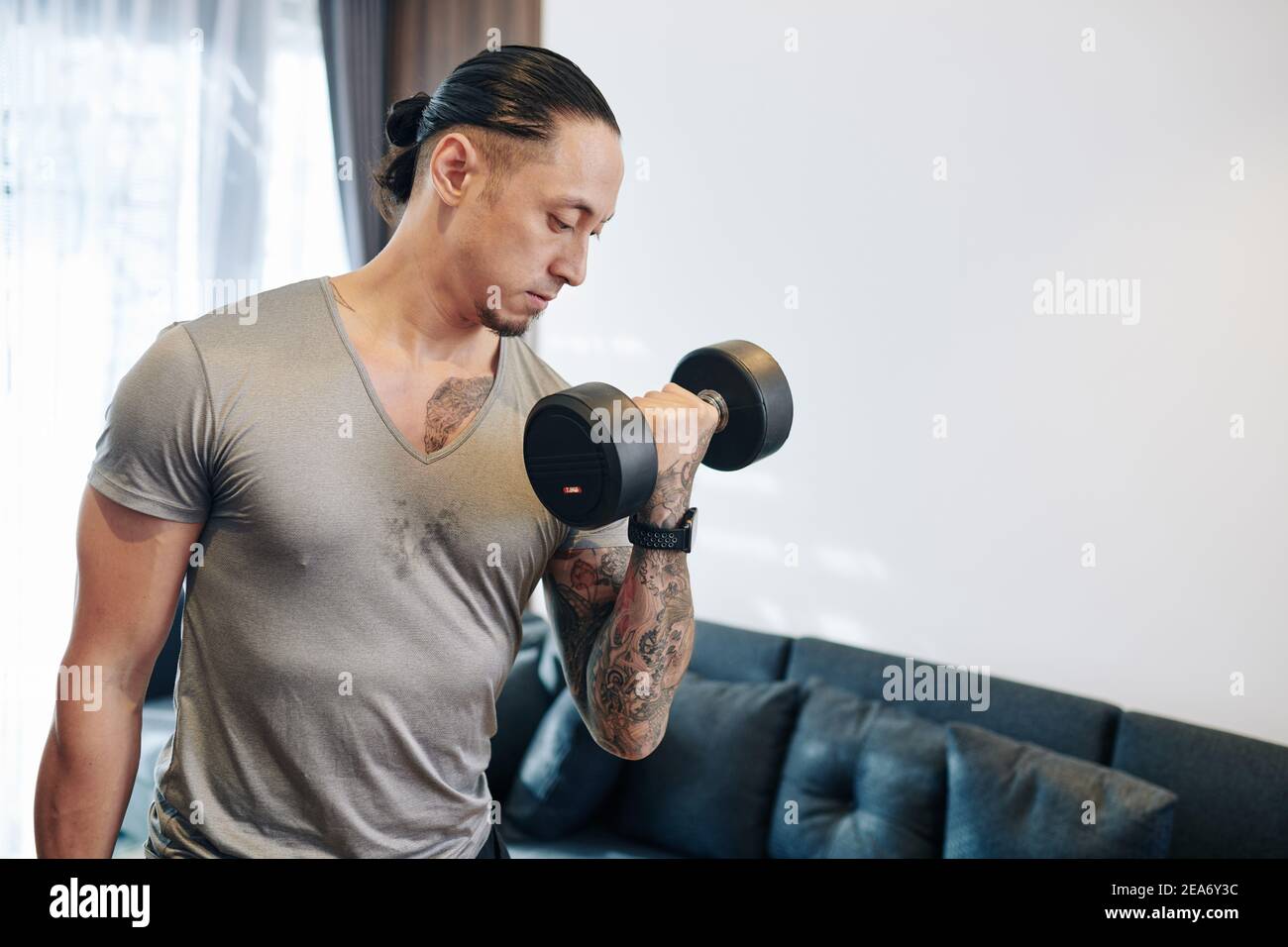 Man pumping biceps Stock Photo - Alamy
