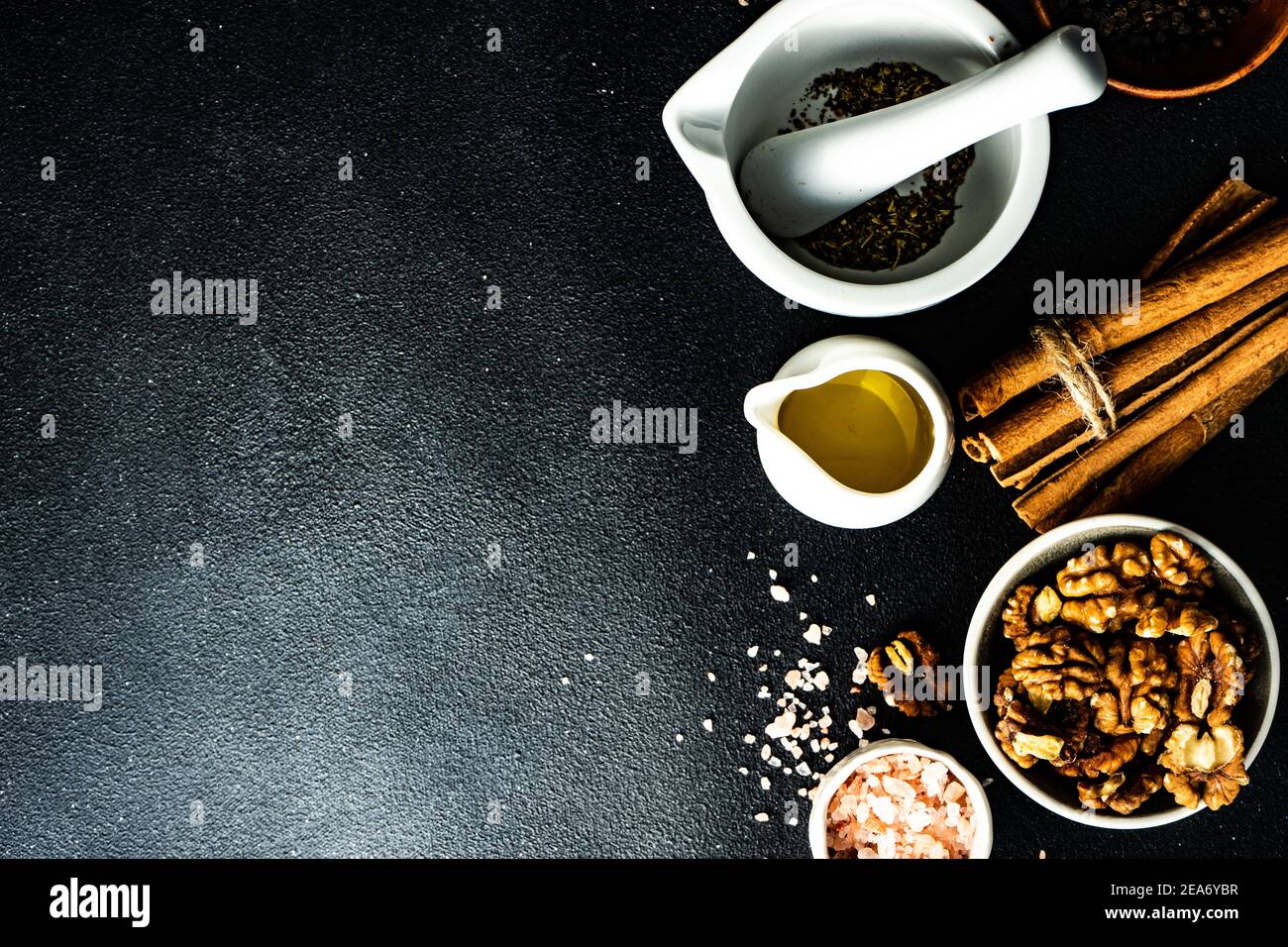 Overhead view of cinnamon sticks, walnuts, salt and pepper Stock Photo ...