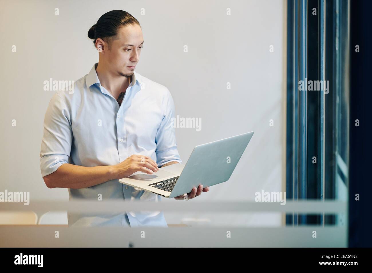 Software developer working on laptop Stock Photo - Alamy