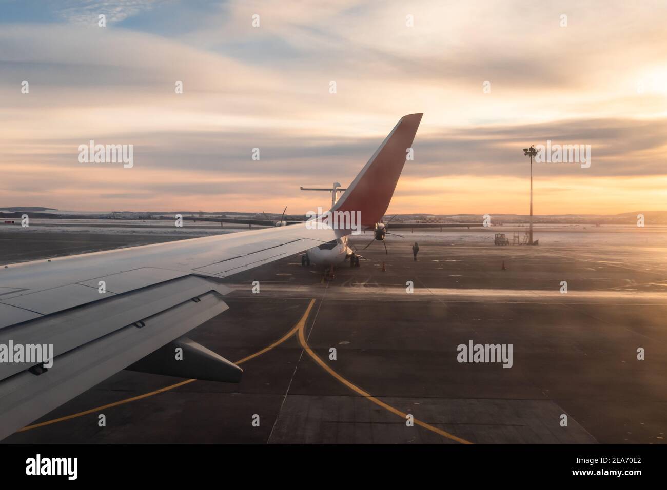 view from the window of an airplane taking off on the runway and the ...